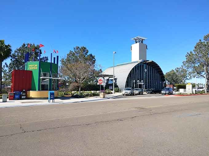 The colorful visitor center flags wave hello like they're genuinely happy you found this coastal gem.