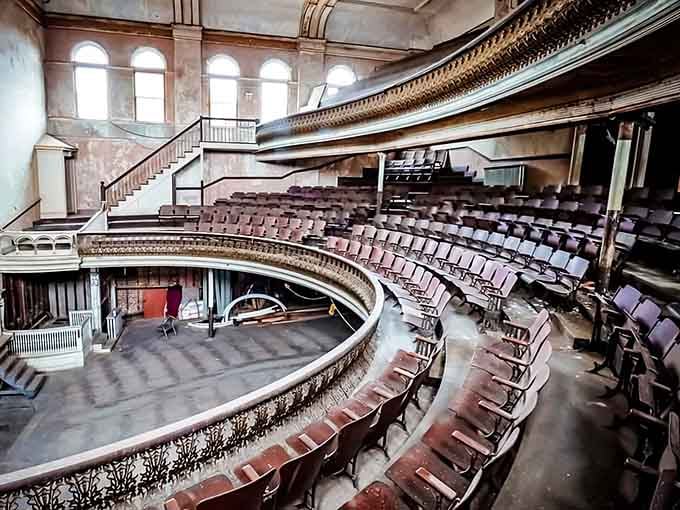 Inside, curved balconies and dusty seats sit frozen in time, echoing with memories of vaudeville shows and community gatherings.