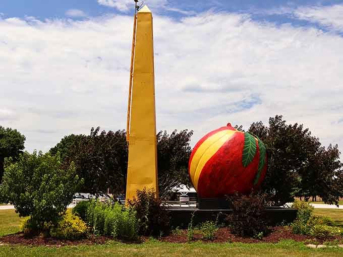 The Big Peach stands as a cheerful roadside landmark, proving Midwest charm comes in oversized fruit form.