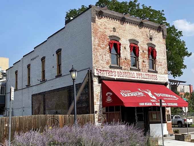 The side view reveals layers of character in this historic building where wild game meets Old West authenticity daily.