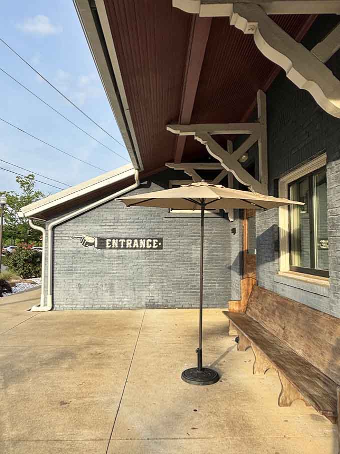 That covered entrance beckons like a station platform, complete with vintage charm and the promise of Southern hospitality.