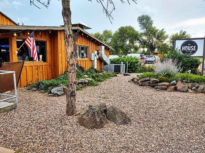 Natural landscaping and weathered wood siding make this spot feel like a cozy neighborhood secret worth discovering.