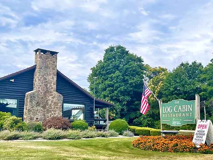 That stone chimney and American flag combination screams "classic comfort food" before you even park the car, friend.