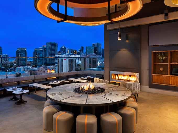 Double fire features create warmth while the city sparkles like a jewelry box all around you.