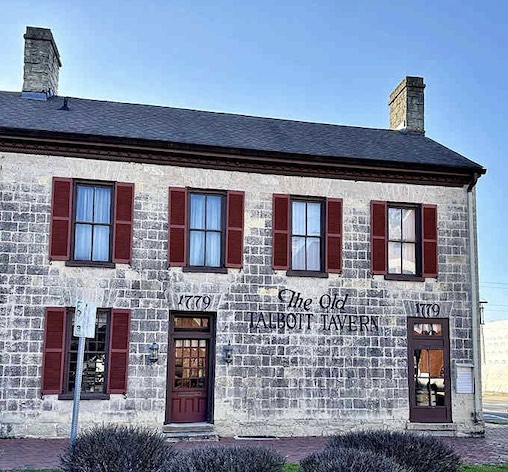 The limestone walls of this centuries-old tavern have absorbed more stories than a library, each stone weathered by time.
