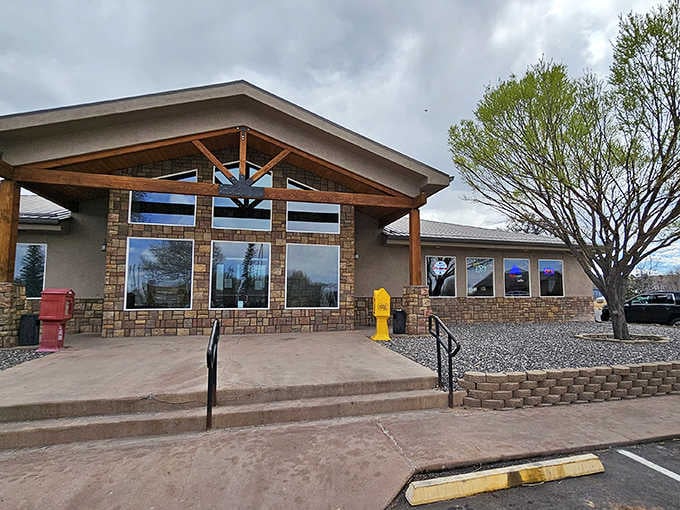 The modern architecture with natural stone accents creates an inviting entrance that says "come on in, friend."