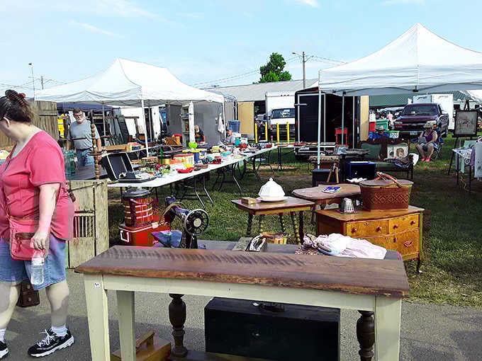 White tents dot the green grass like a village of bargain hunters setting up their temporary treasure kingdoms.