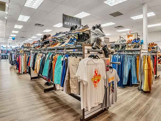 Modern displays showcase trendy clothing organized by color, proving thrift shopping can feel downright boutique-like and chic.