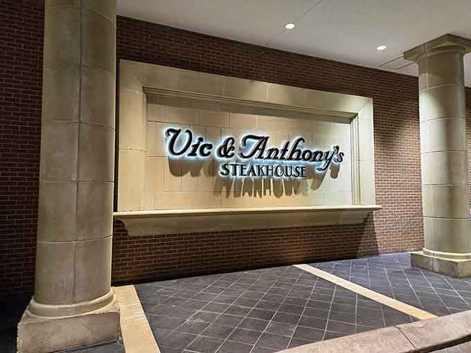 That illuminated sign against brick creates the kind of sophisticated glow that says "special occasion" in the best way.