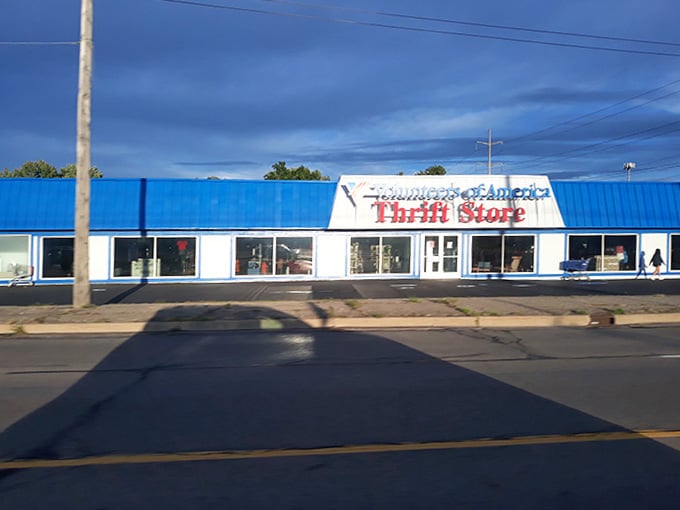 Afternoon shadows stretch across the pavement as another satisfied shopper heads inside for hidden gems.