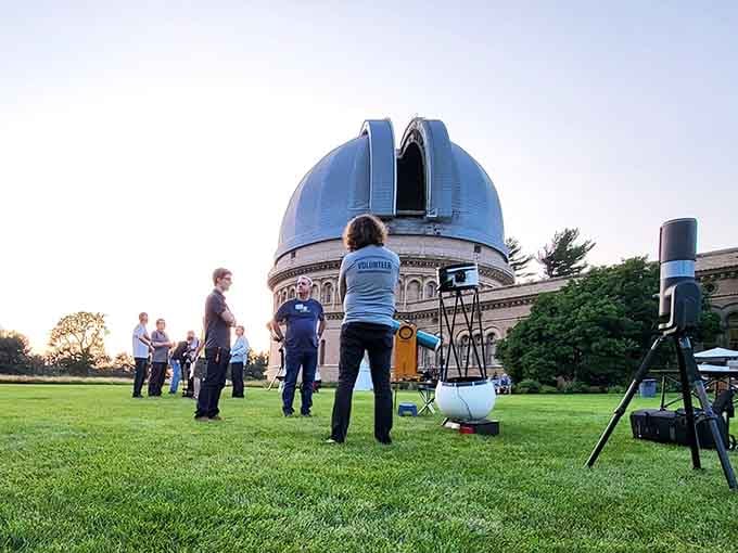 Sunset transforms the lawn into an outdoor classroom where curious minds gather to explore the universe.