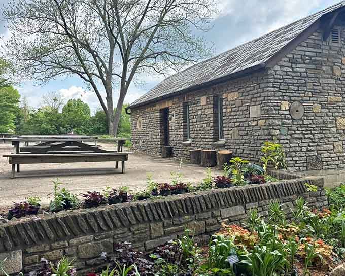 Stone walls and carefully tended flower beds show how historic architecture and living plants create perfect harmony together.