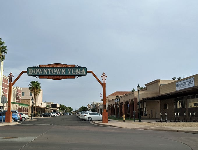 The Gateway to the Great Southwest arch welcomes visitors with old-fashioned pride, framing a street that's seen generations pass.