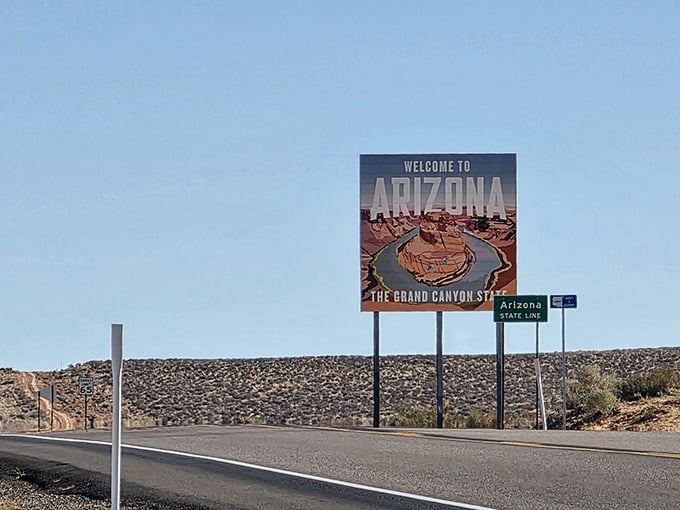 The state line marker stands proud, officially declaring you've entered the land of eternal summer and reasonable humidity.