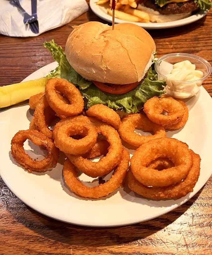 The Abbey Burger with those golden onion rings proves that some things are better than holding hands.