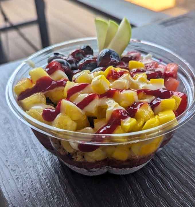 Fresh fruit and granola create a sunrise in a bowl, minus the 5 a.m. wake-up call.