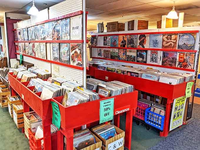 Vinyl records lined up in brilliant red bins, waiting to spin the soundtrack of your youth once again.
