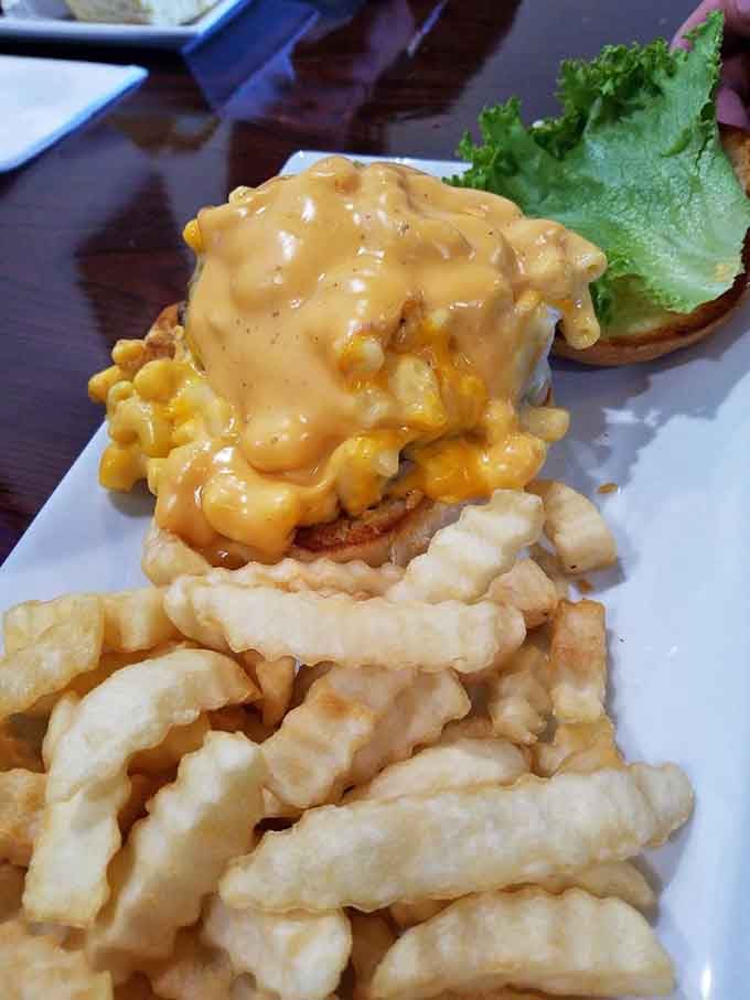 That cheeseburger and mac and cheese combo proves someone in the kitchen understands what true happiness looks like on a plate.