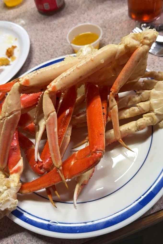 Those Alaskan snow crab legs glisten with butter, ready to reward your cracking efforts with sweet, tender meat inside.