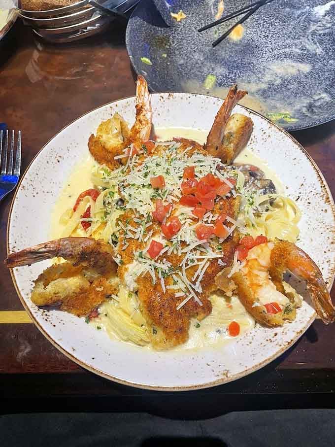 Pasta topped with shrimp so perfectly golden they deserve their own Instagram account and agent.