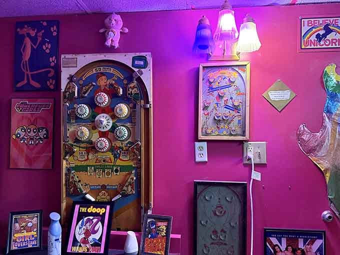 A bright pink wall covered in pop culture treasures proves that more is definitely more here.
