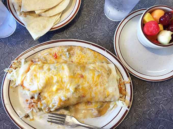 Swimming in green chile and cheese, this smothered beauty is basically a warm, delicious hug on a plate.