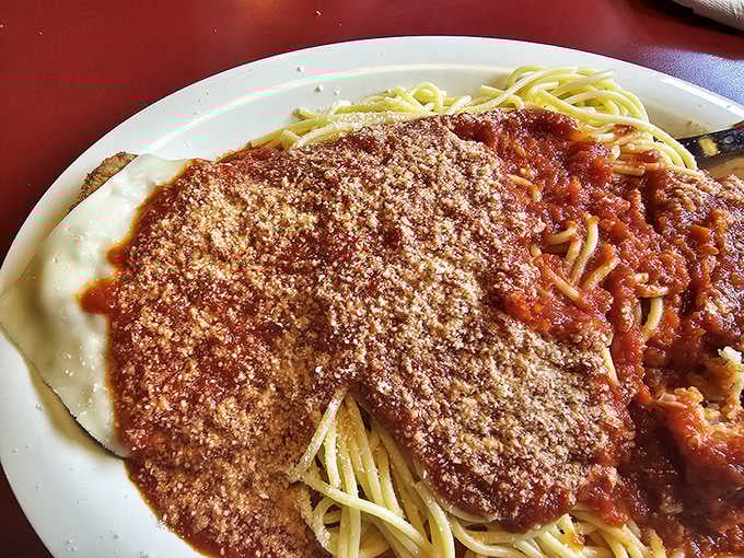 That generous blanket of meat sauce and parmesan on spaghetti is basically a warm hug in pasta form.