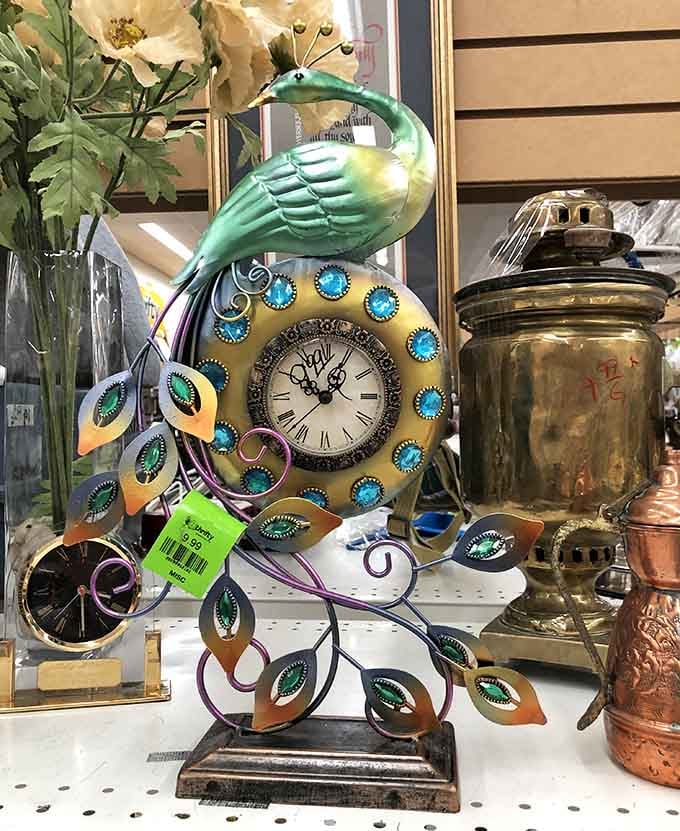 This peacock clock is giving major "grandma's fancy living room" energy, and honestly, we're here for it completely.