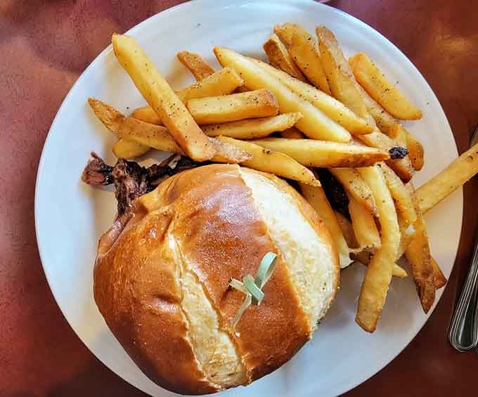 That pretzel bun cradles pulled pork like a Bavarian bear hug, proving fusion cuisine works when done with love.