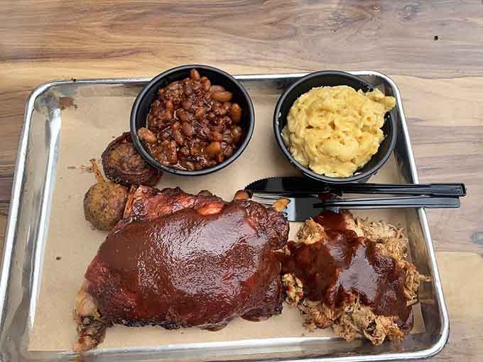 Baby back ribs with mac and cheese and beans, the holy trinity of barbecue that makes cardiologists nervous.