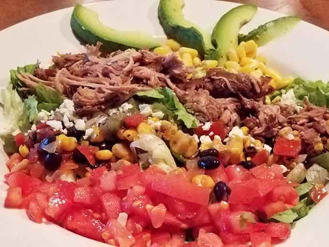 This Tex Mex bowl loaded with carnitas and fresh avocado proves healthy eating doesn't mean sacrificing flavor.