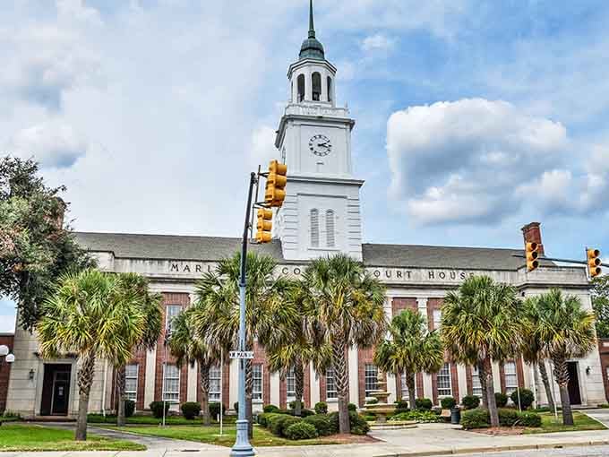 The courthouse's stately white tower rises above palmetto trees like a beacon of Southern civic pride and architectural good taste.