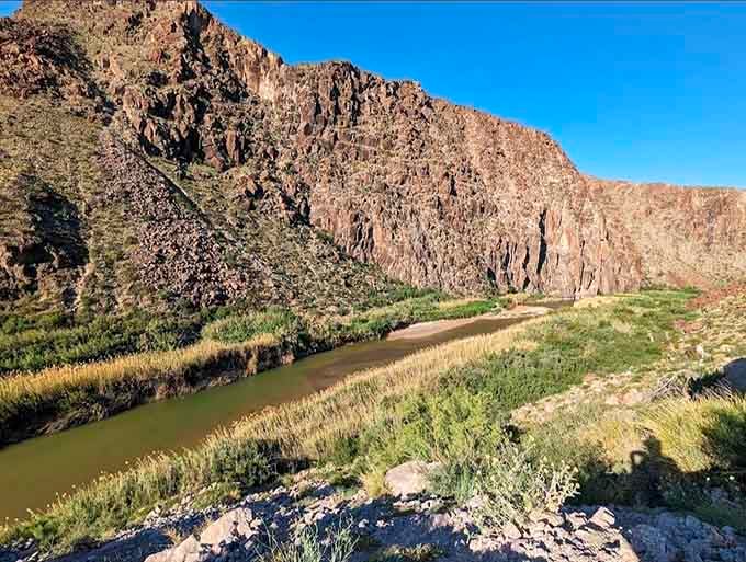 The Rio Grande winds through the canyon, creating a ribbon of life in an otherwise unforgiving landscape.
