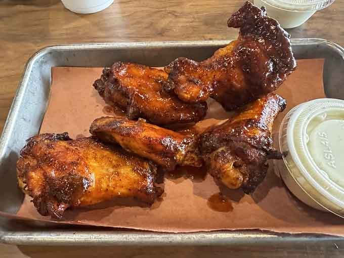 Hickory-smoked wings with that perfect glaze prove chicken can absolutely steal the show here.