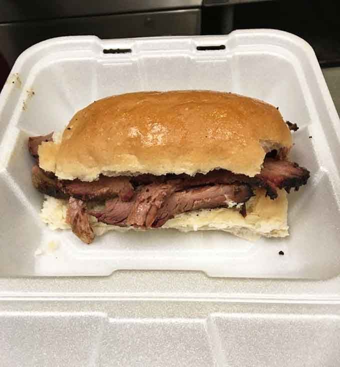 Tender brisket piled high on a soft bun proves that sometimes the simplest presentation lets the meat do all the talking.