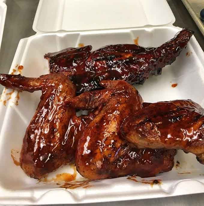 Wings and ribs glazed to perfection, proving that patience and smoke create edible magic every single time.