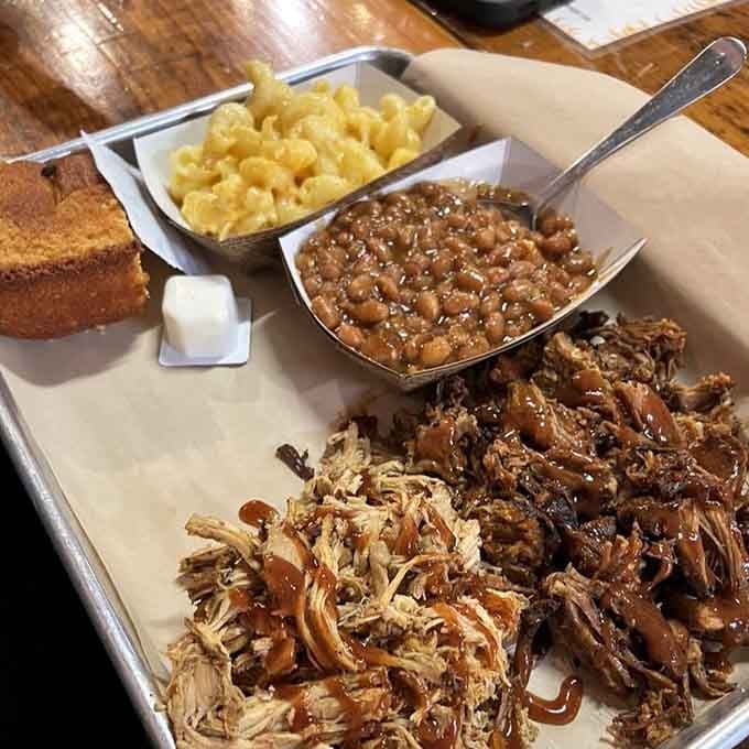 Pulled pork, mac and cheese, beans, and cornbread create the kind of plate that makes you forget your name.