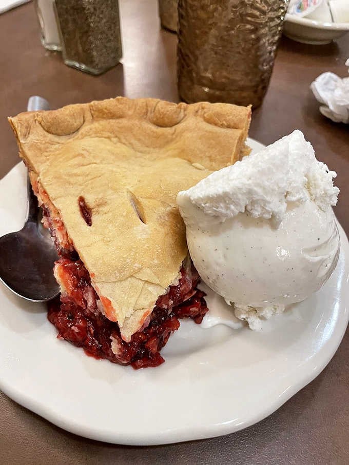 That golden crust and ruby-red filling with a scoop of vanilla ice cream is basically summer vacation on a plate.