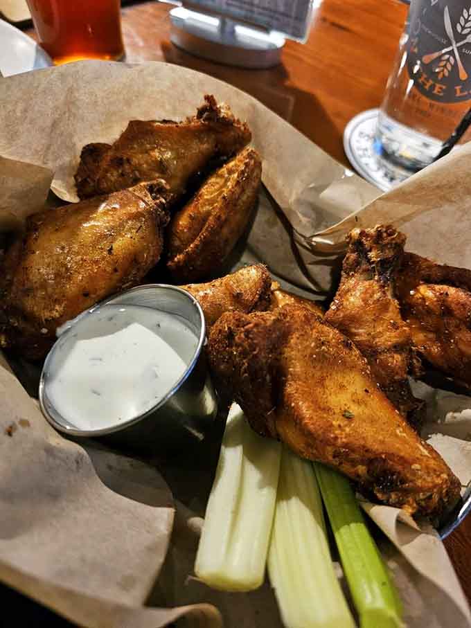 Smoked wings with celery sticks and blue cheese&mdash;the holy trinity of appetizers done absolutely right here.