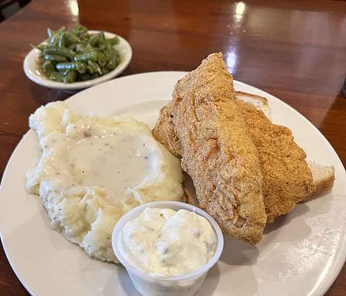 Golden fried fish with creamy mashed potatoes and green beans delivers the kind of satisfaction that never goes out of style.