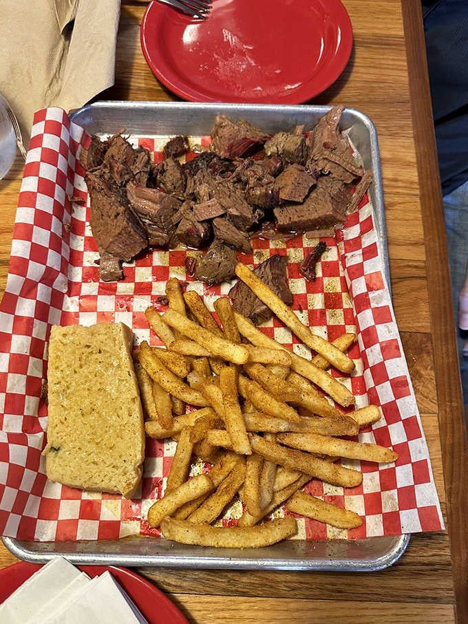 Brisket so tender it practically apologizes for falling apart, served with fries that earned their keep honestly.