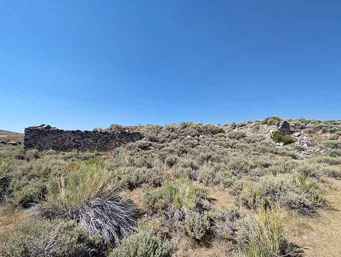 Stone foundations scattered across the sagebrush hint at neighborhoods that once bustled with thousands of hopeful residents seeking fortune.