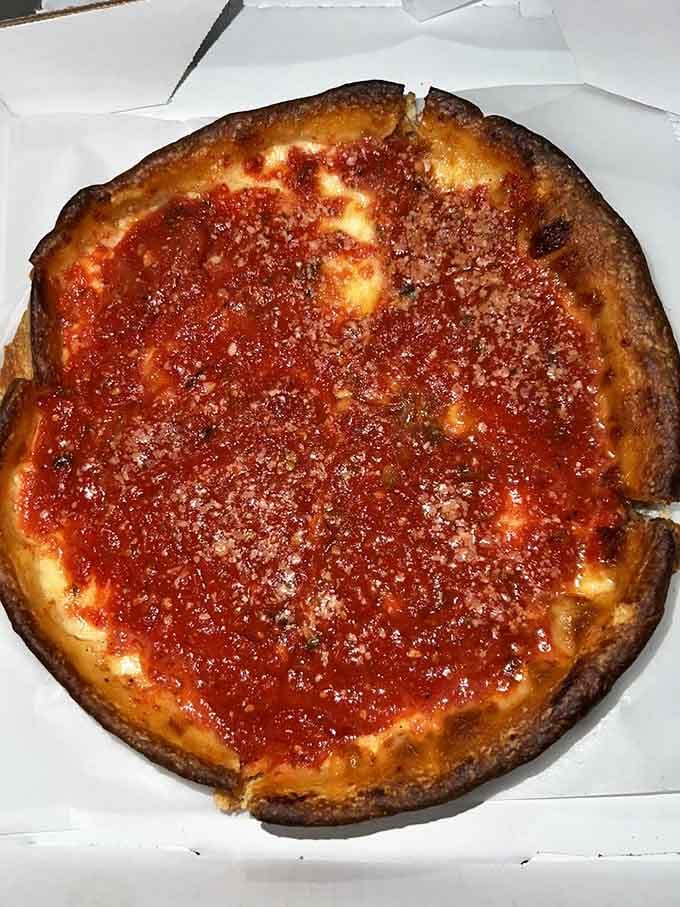 That buttery crust and molten cheese layer is basically a warm hug in pan form, minus the awkwardness.