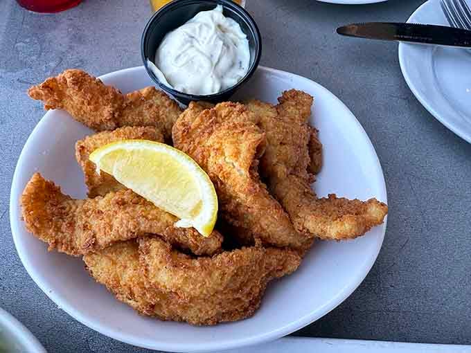 Golden fried catfish that proves Southern cooking is an art form, not just a regional accident of deliciousness.