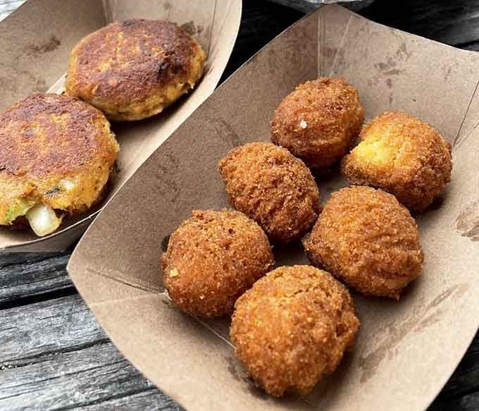 These hush puppies are so perfectly golden and round, they look like they were sculpted by someone who really understands Southern comfort food.
