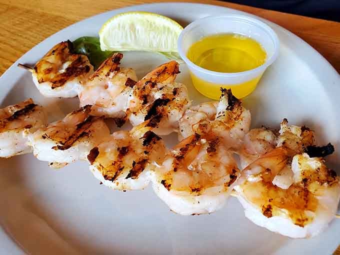 Grilled shrimp that looks like it just came off a beachside grill, butter and lemon ready for action.