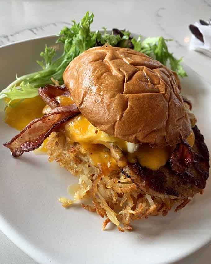 The Bluebell's Breakfast Burger stacks bacon, egg, and hash browns into pure morning genius.