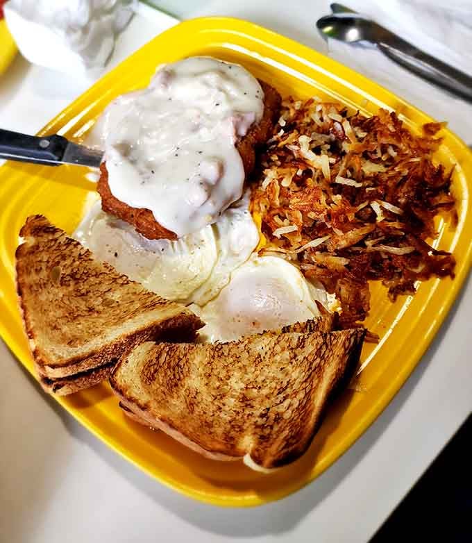 Country fried steak smothered in creamy gravy with crispy potatoes makes every other breakfast look like an underachiever.