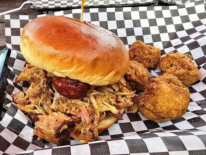 Pulled pork piled high with golden hush puppies proves that sometimes more really is more, deliciously so.