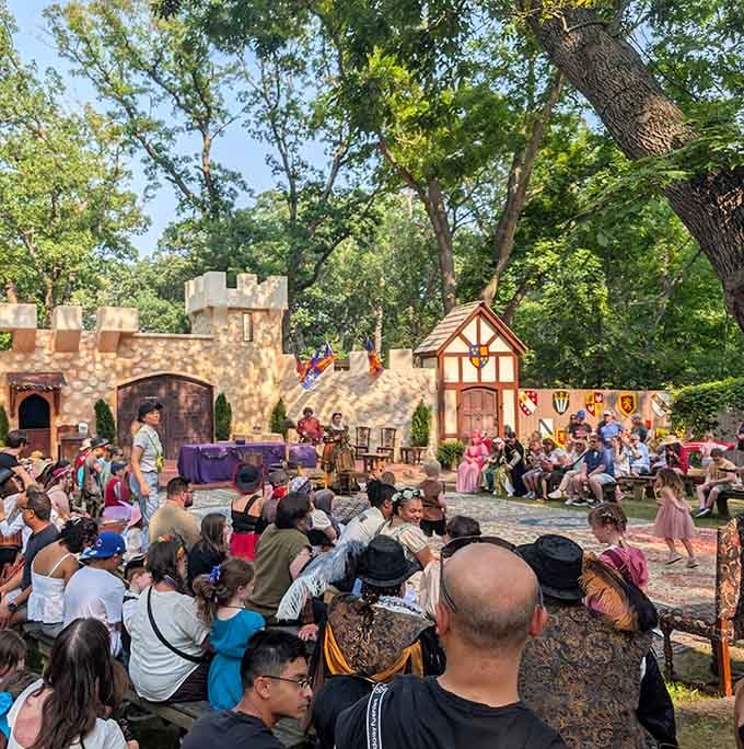 The royal court processes in full regalia, proving Wisconsin does Elizabethan England better than most English villages.